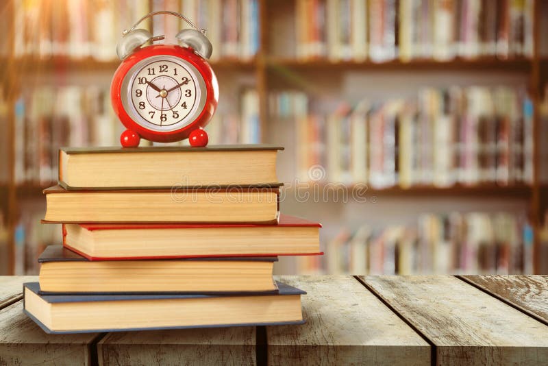 Composite Image of Old Alarm Clock and Stack of Books Stock Photo ...