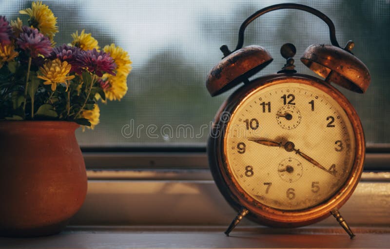 Old Alarm Clock on the Window Stock Photo - Image of minutes, bronze ...