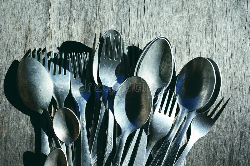 Old Aluminium Spoons and Forks on a Wooden Surface. Stock Image - Image ...
