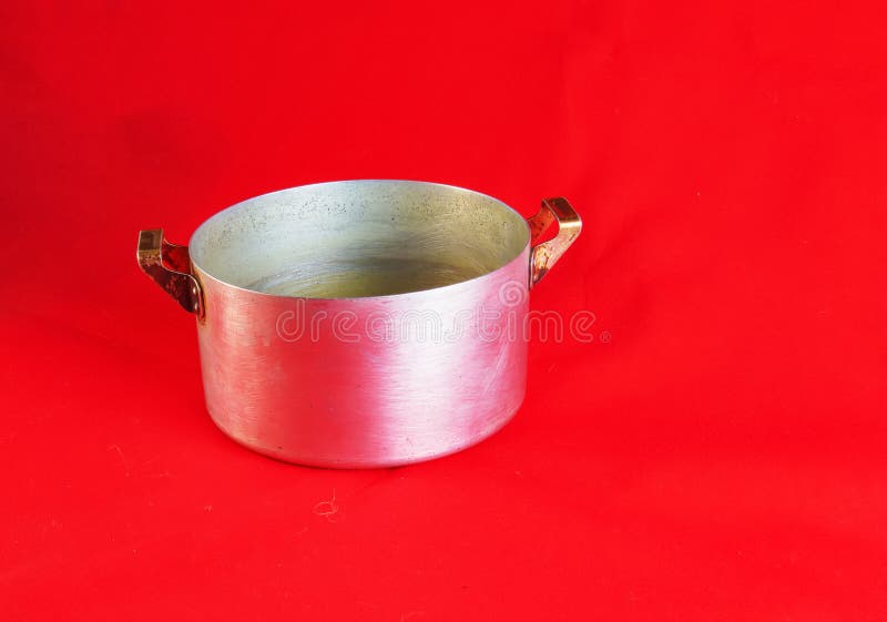 An Old Aluminum Pan Made in Circa 1960 Against a Red Background Stock ...