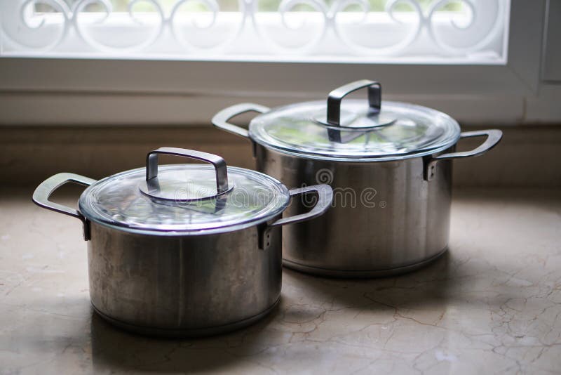 Old Aluminum Stainless Steel Cooking Pot on Kitchen Table Stock Image ...