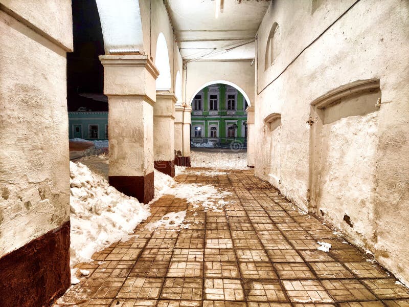 Old Ancient Colonnade Pathway at Night. Dimly Lit Corridor with Arches ...