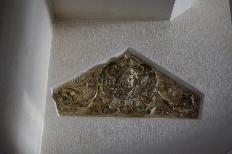 Old angle in a modern wall editorial image. Image of angelsymbold ...