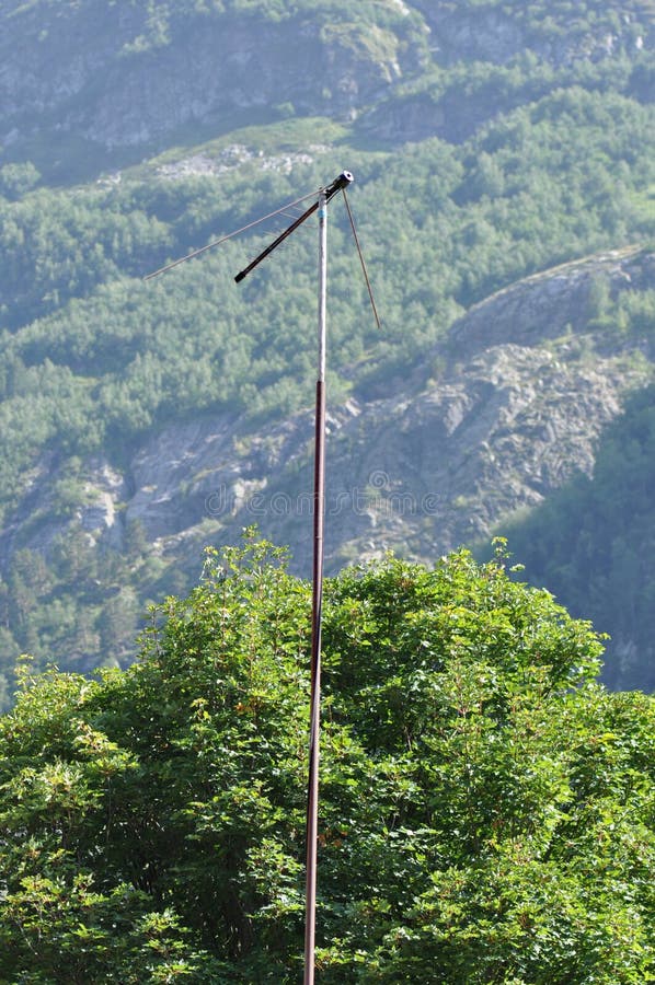 A Tall Red Pole with a Ladder on it Stock Image - Image of pole, line ...