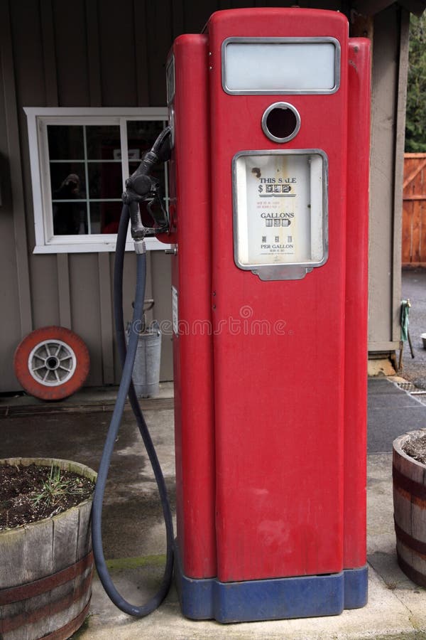 Old Antique Gas Pump in Front of Auto Business Stock Image - Image of ...