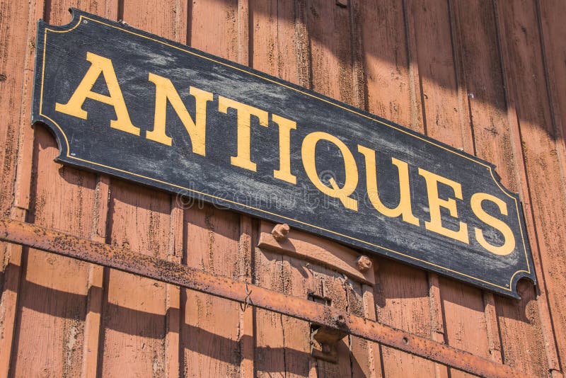 Antiques sign letterpress stock photo. Image of wood - 36335426