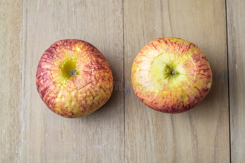 Old apple on wooden board stock image. Image of organic - 59938711