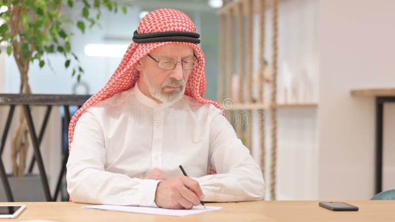 Old Arab Businessman Writing on Paper Stock Image - Image of gesturing ...