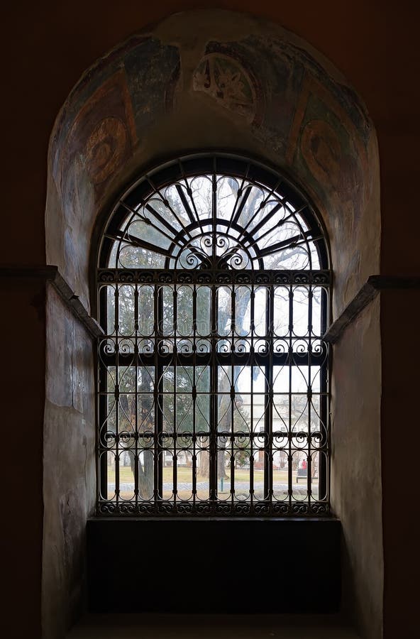 Old Arched Window in a Church with Iron Grilles in Front Stock Photo ...