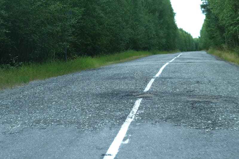 Old Asphalt. Budget Repair the Road. Broken Asphalt in the Forest ...