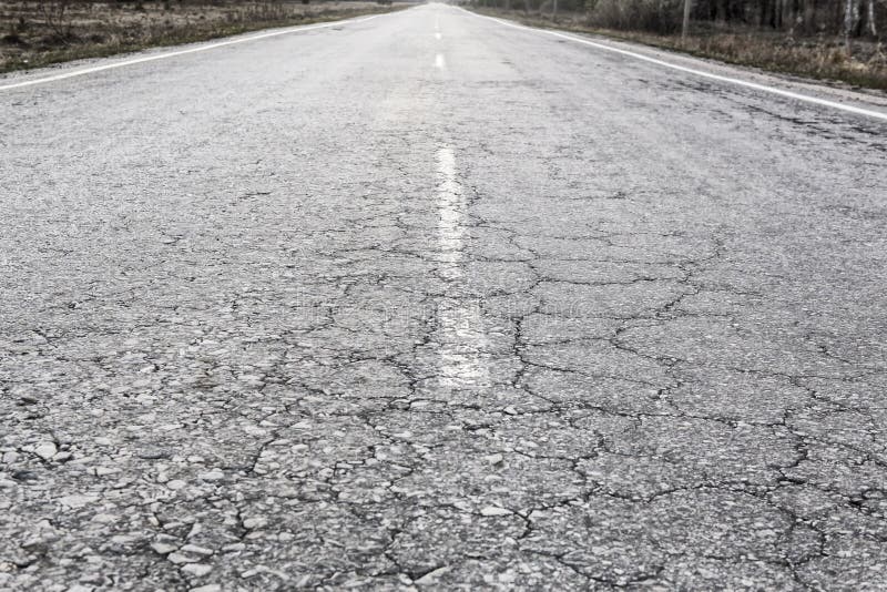Level Asphalted Road with a Dividing Yellow Stripes. the Texture of the ...