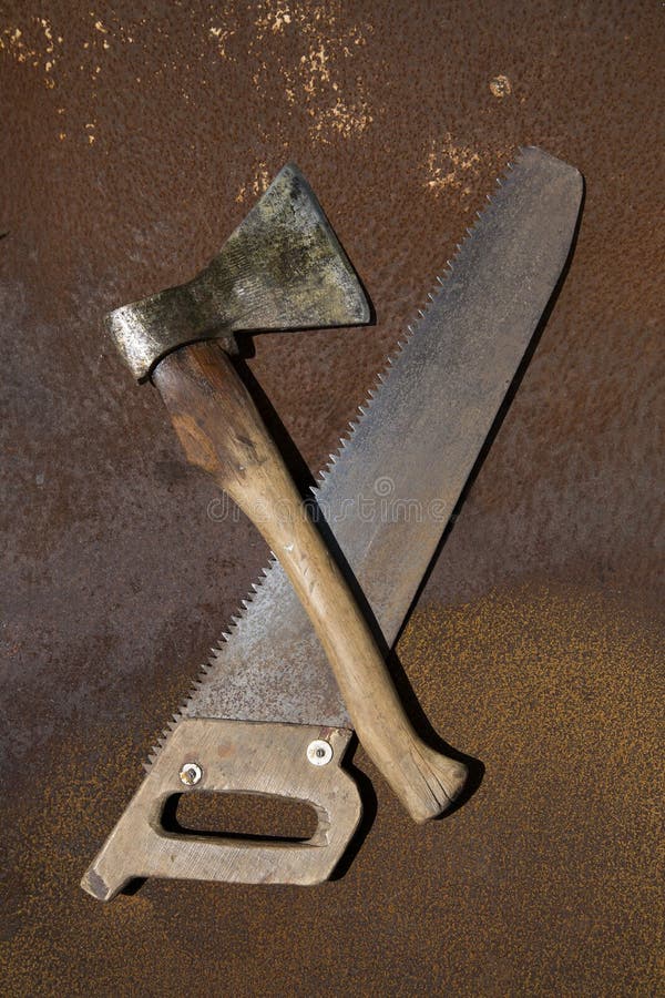 Old Ax and Old Wood Hacksaw on a Rusty Metal Sheet Stock Photo - Image ...