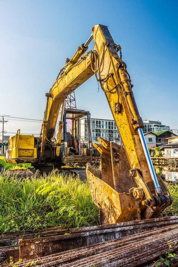 Old Backhoe and Steel Rods at Construction Site Stock Image - Image of ...
