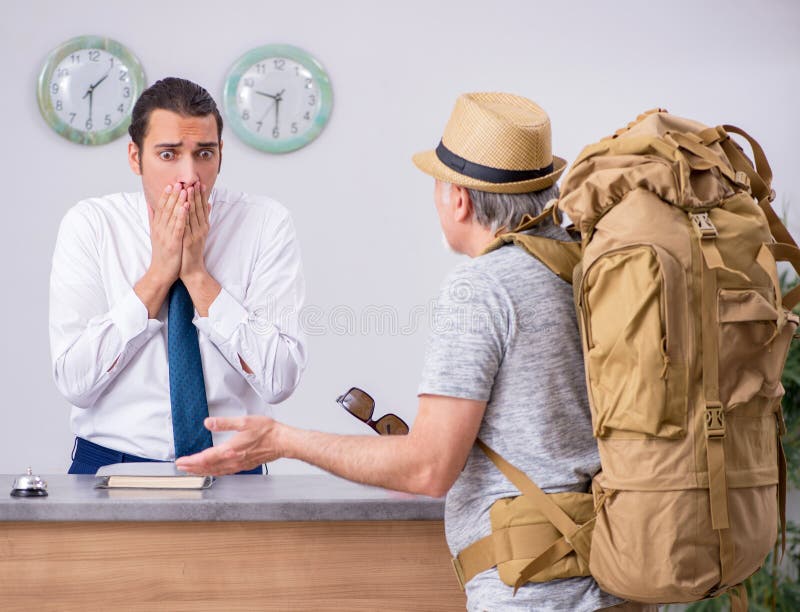 Backpacker at the Hotel Reception Stock Image - Image of business ...
