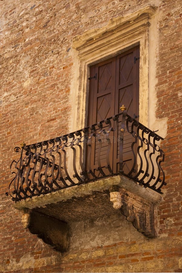 Old balcony in Verona stock photo. Image of brick, wood - 15648696