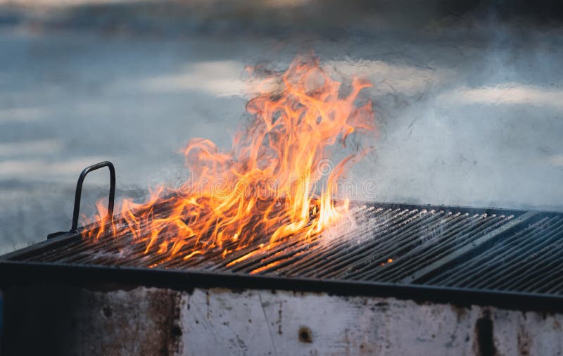 Old Barbeque Grill with Fire Flames Coming Out Stock Photo - Image of ...