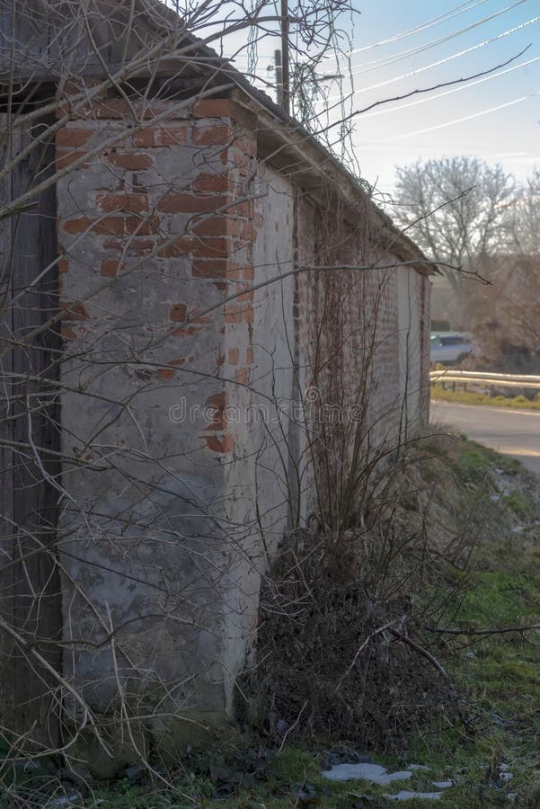 Old Barn Made of Bricks and Wood by a Country Road. Stock Image - Image ...