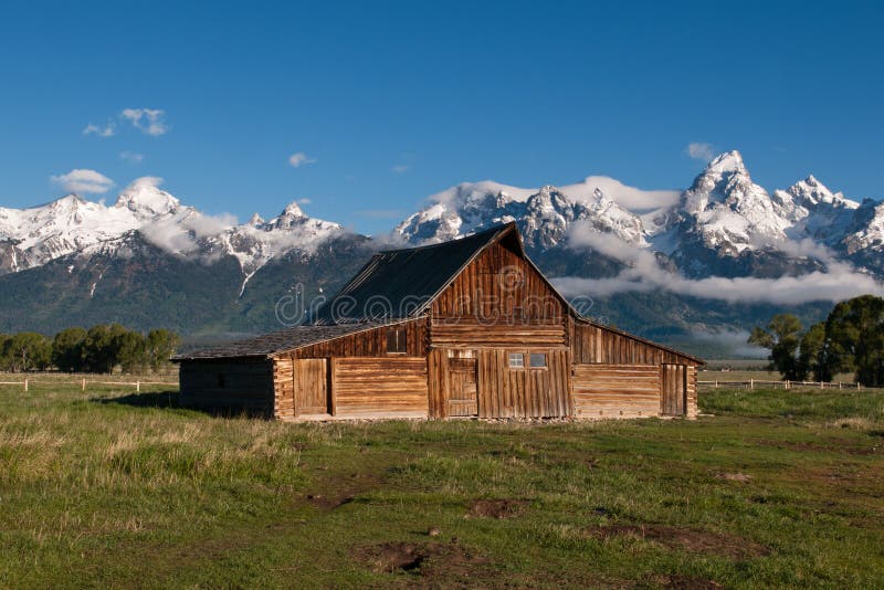 Old Barn Under Mountains stock photo. Image of mountains - 25828744