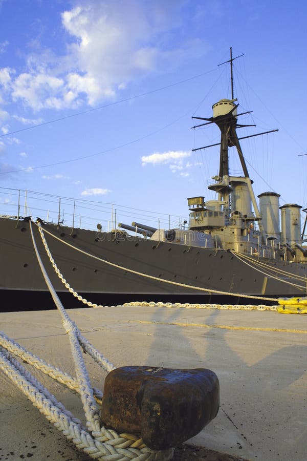 Old Battleship Tied To Pier Stock Photo - Image of floating, hawser ...