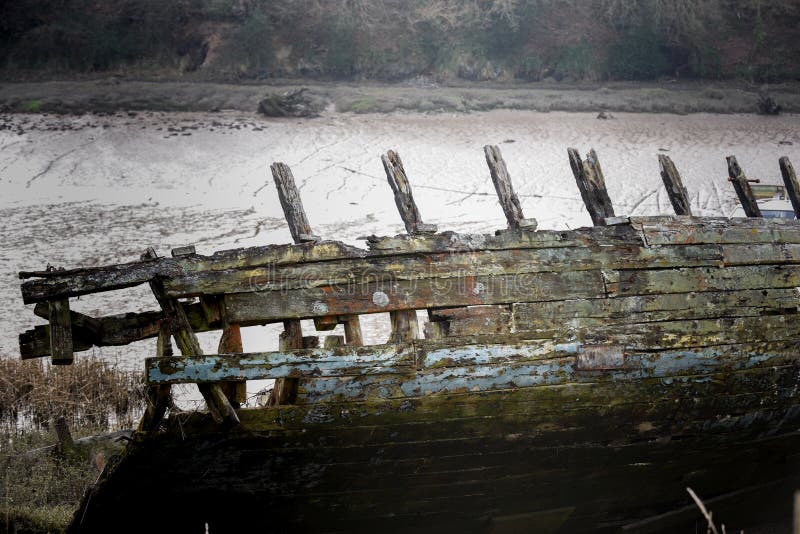 An Old Beached Wooden Boat Falling Apart and Decaying at Low Tide Stock ...