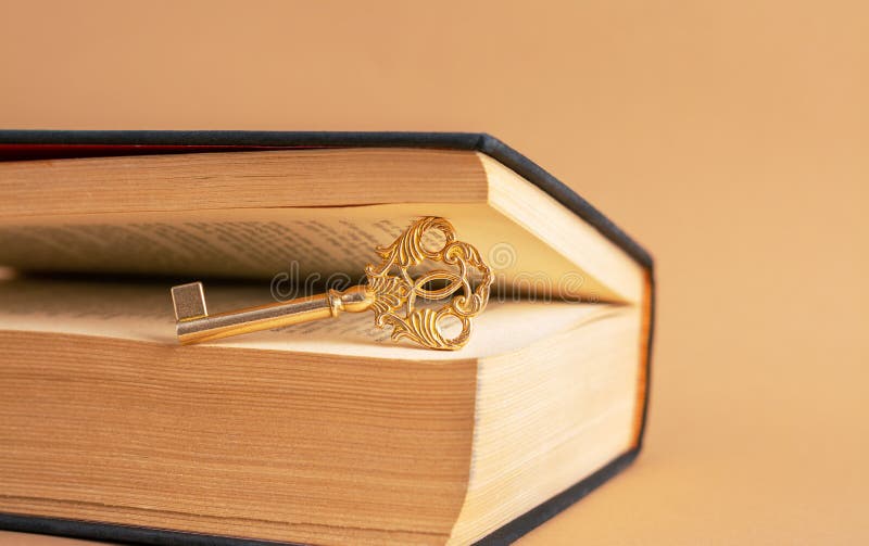A Old Beautiful Key between the Pages of Old Book. Stock Photo - Image ...