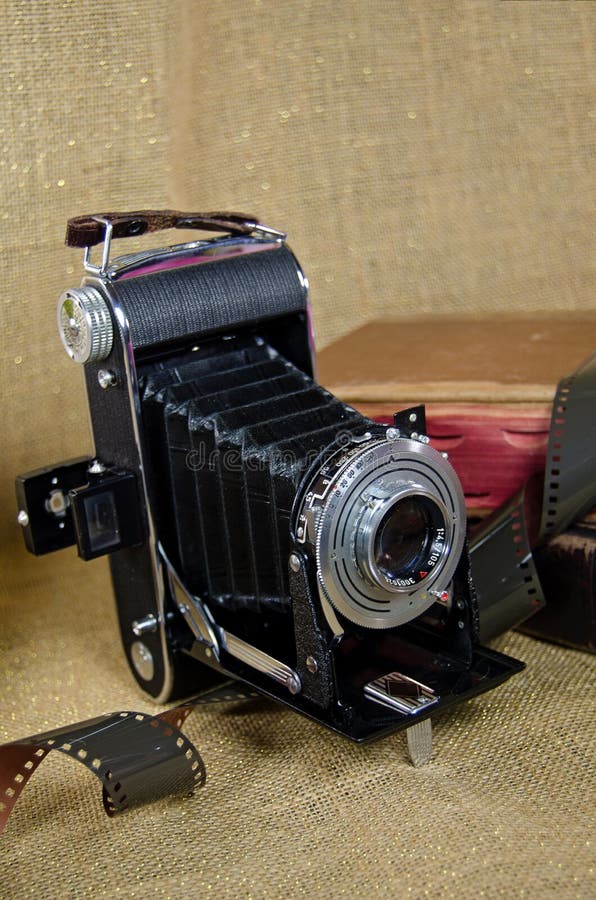 Old Bellows Camera with Film Stock Photo - Image of burlap, fabric ...