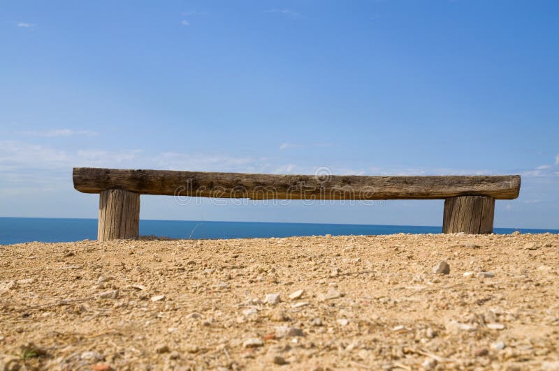 Old bench facing the sea stock image. Image of middle - 16791707