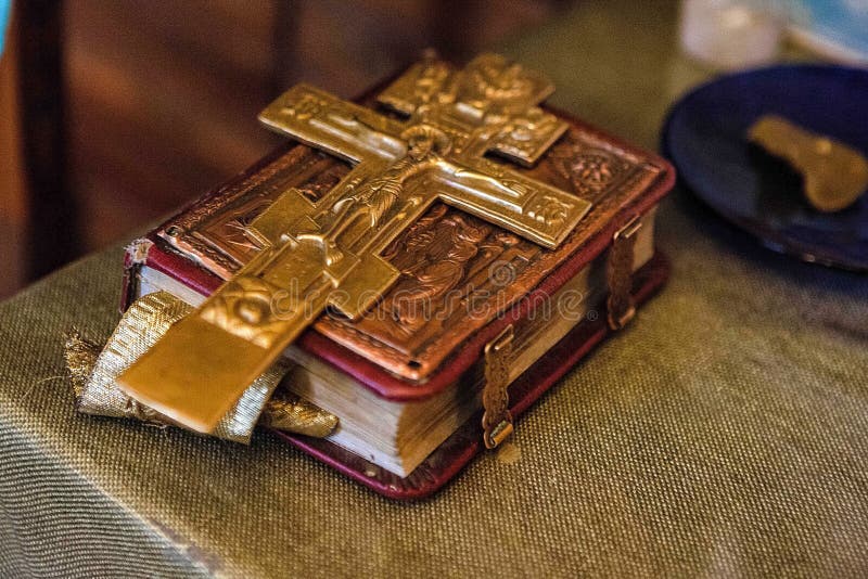 Old Bible with a Lock on the Binding and a Cross is on the Book Stock ...