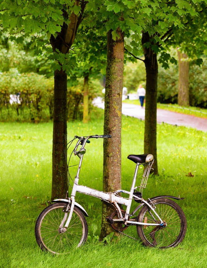 An Old Bicycle with Rust Marks, Scratches, and Scuffs Leaned Against a ...