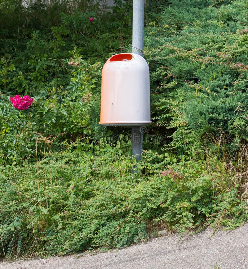 Old bin, hanging on a pole stock image. Image of recycle - 99826919