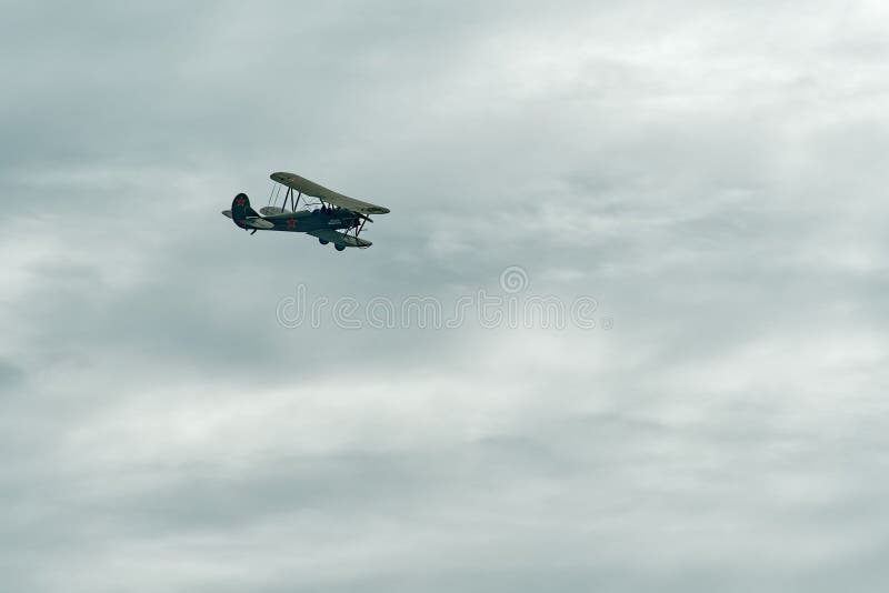 Biplane Fighter Plane in Full Flight, Crossing the Clouds Editorial ...