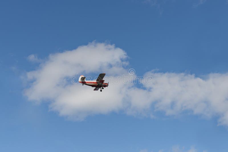 Old Biplane Flying in the Blue Sky Stock Photo - Image of fair, outdoor ...