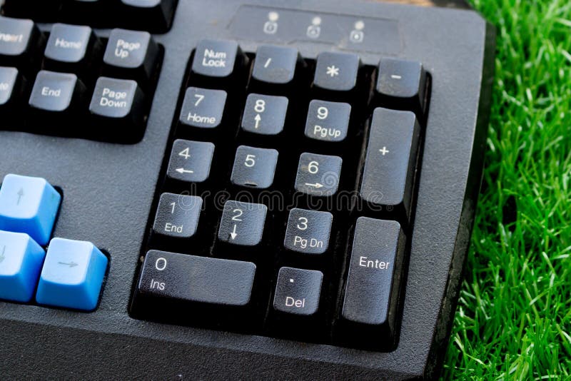 Old Black Computer Keyboard on Decorate Green Artificial Grass Stock ...