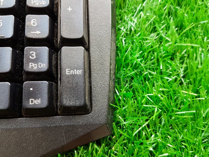Old Black Computer Keyboard on Decorate Green Artificial Grass Stock ...