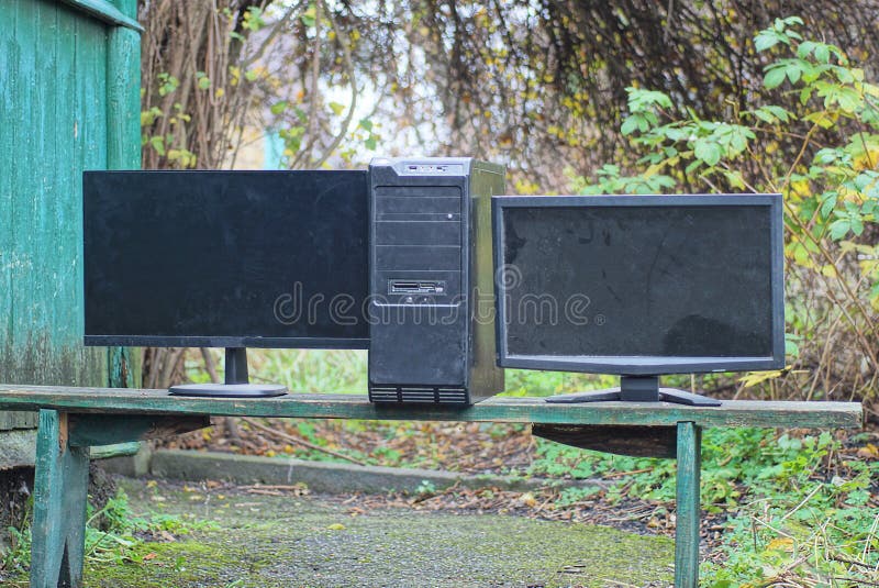 An Old Black Desktop Computer and a Two Large Dirty Monitors Stock ...