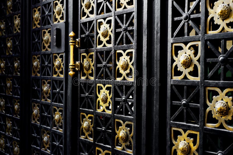 Old Black Iron Gate with Golden Ornaments Stock Photo - Image of gate ...