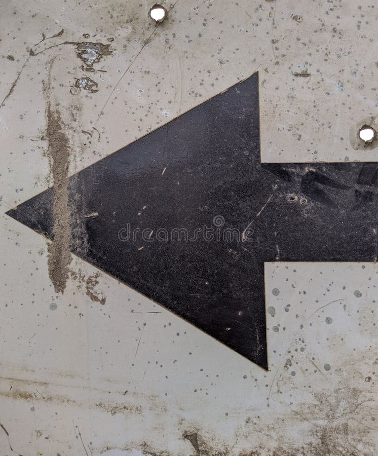 Old and Black Metal Arrow Sign Points To the Left Stock Image - Image ...