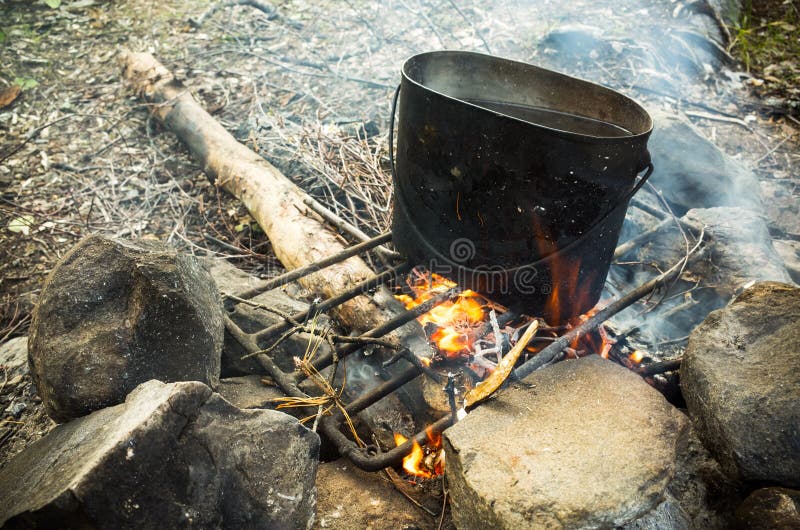 Old Black Pan with Boiling Water on Bonfire Stock Photo - Image of ...