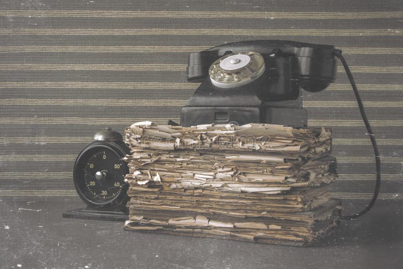 Old Black Phone and Stack of Battered Books Stock Photo - Image of ...