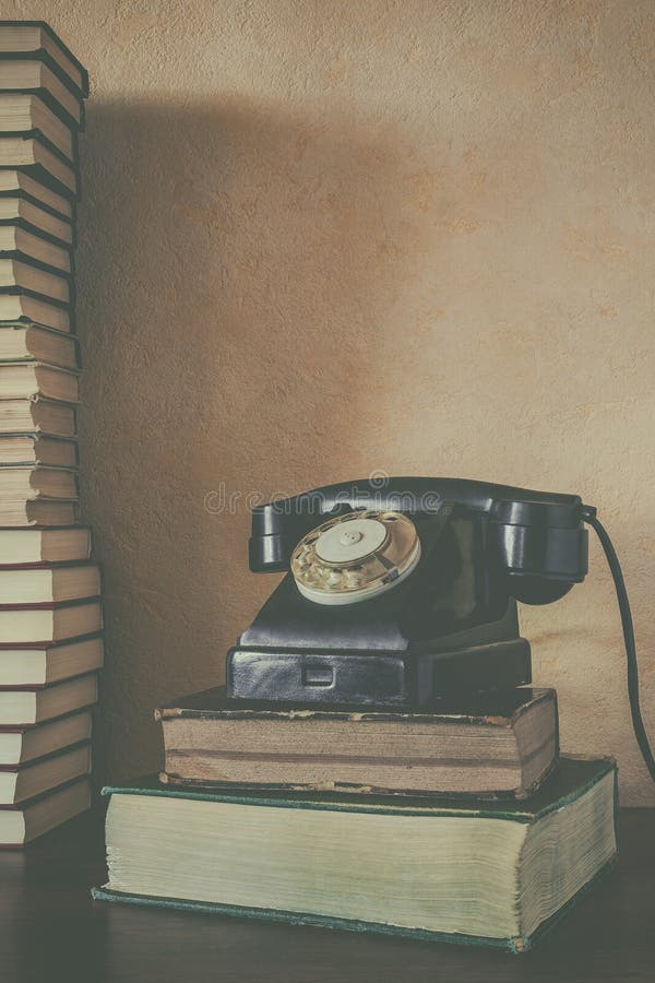 Old Black Phone and a Stack of Books Stock Image - Image of vintage ...