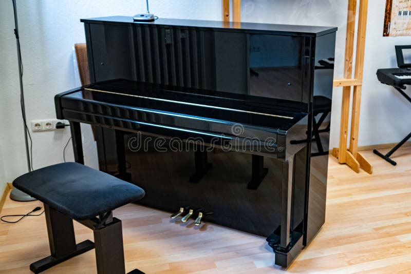 Old Black Piano with a Stool in Front of it Editorial Image - Image of ...