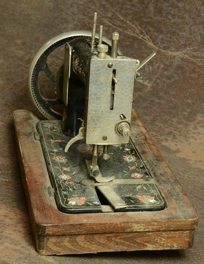 Old Black Sewing Machine on a Sheet of Rusty Iron. Stock Photo - Image ...