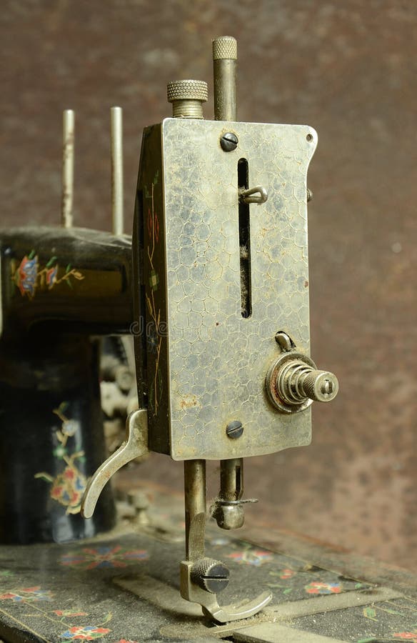 Old Black Sewing Machine on a Sheet of Rusty Iron. Stock Photo - Image ...