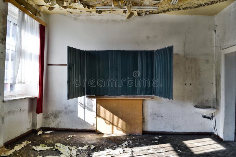 An Old Dilapidated Room with Desk and Chair Stock Photo - Image of desk ...