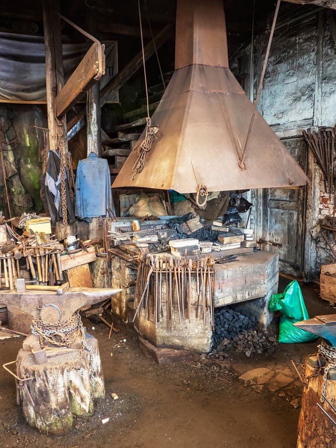 An Old Blacksmiths Forge and Workshop Full of Tools, Portrait View ...