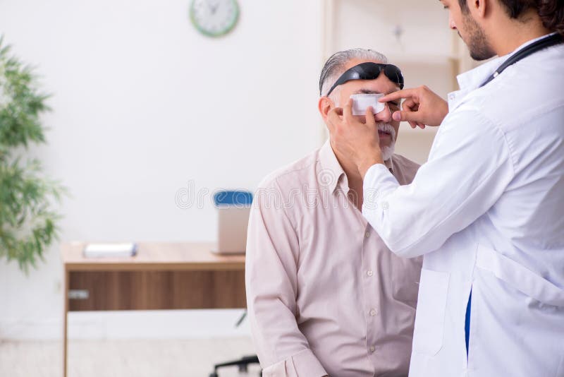 Old Blind Man Visiting Young Male Doctor Stock Photo - Image of ...