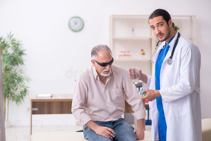 Old Blind Man Visiting Young Male Doctor Stock Image - Image of glass ...