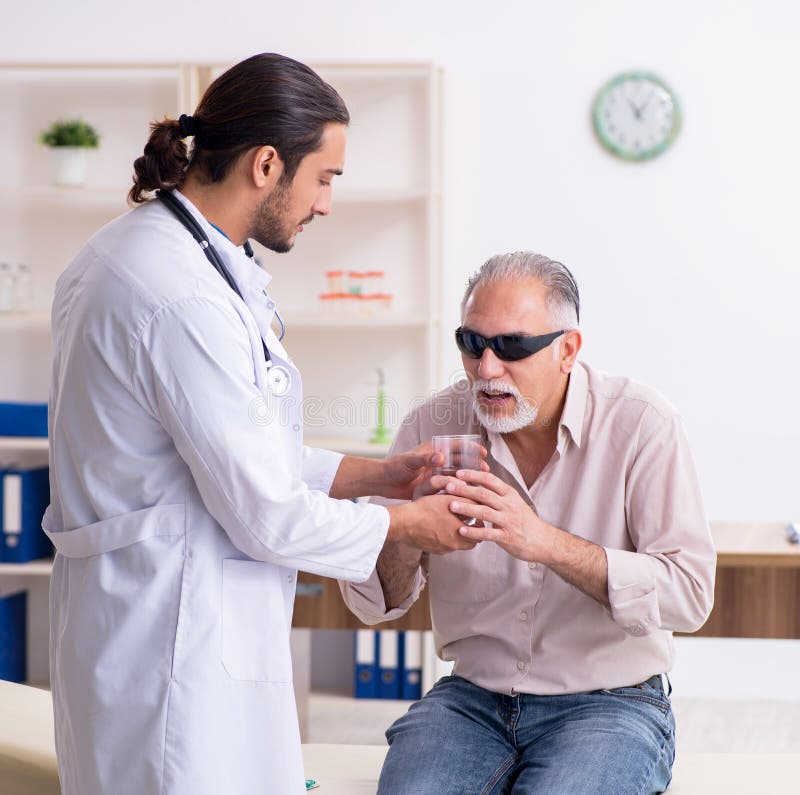 Old Blind Man Visiting Young Male Doctor Stock Image - Image of ...