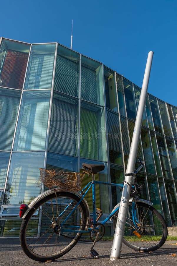 Old Blue Bike in Front of a Modern Building Stock Photo - Image of ...