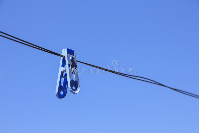 Old Blue Cloth Pin Hanging on Old Rusty Wire Stock Photo - Image of ...
